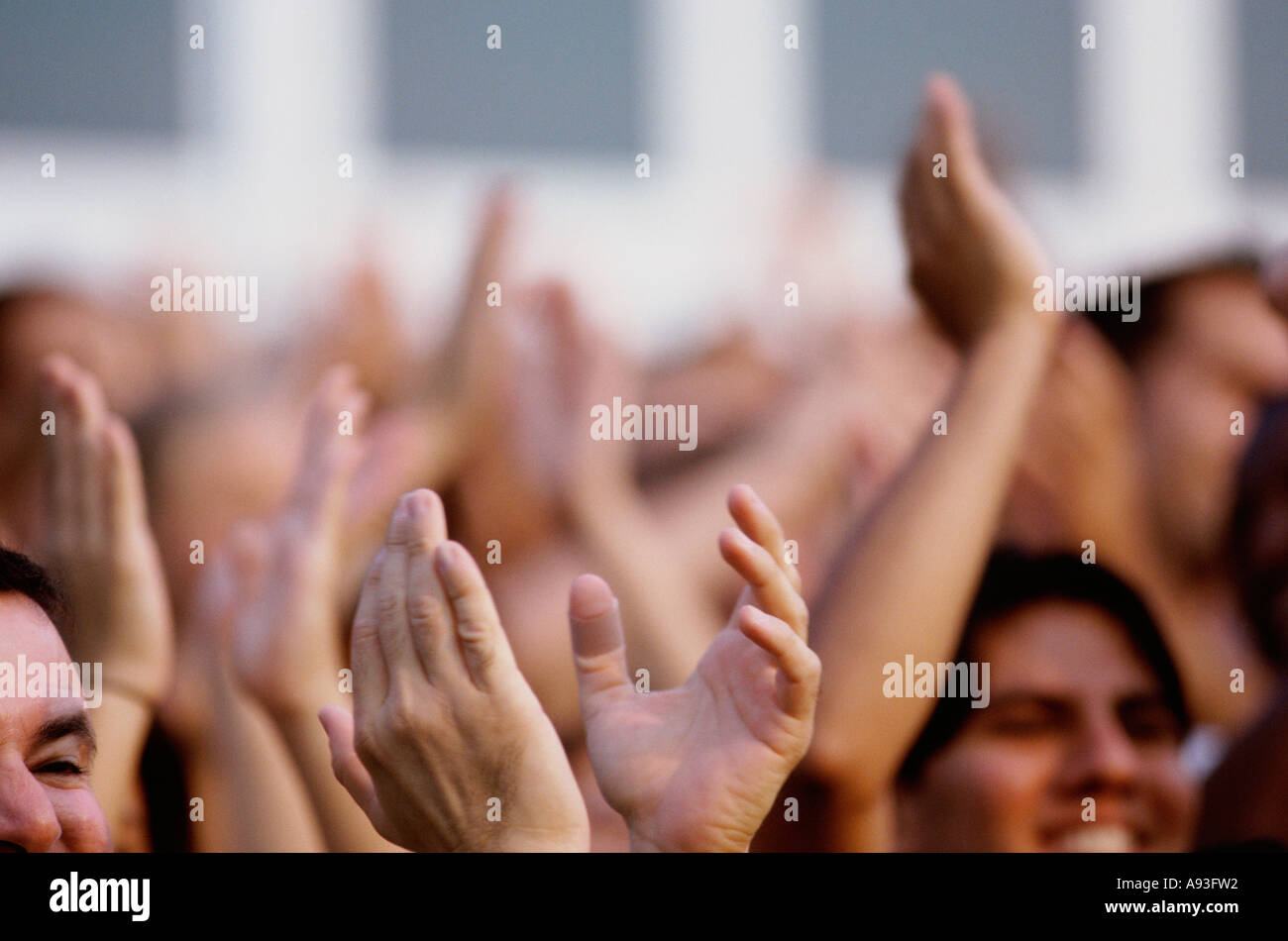 Spectators applauding in a stadium Stock Photo - Alamy