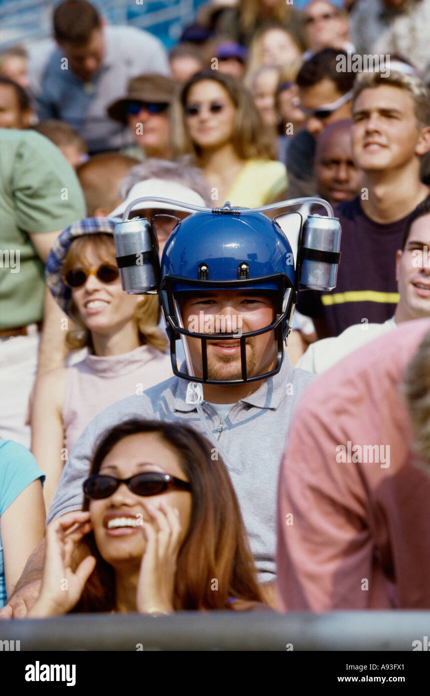 Portrait of a spectator wearing a football helmet Stock Photo - Alamy