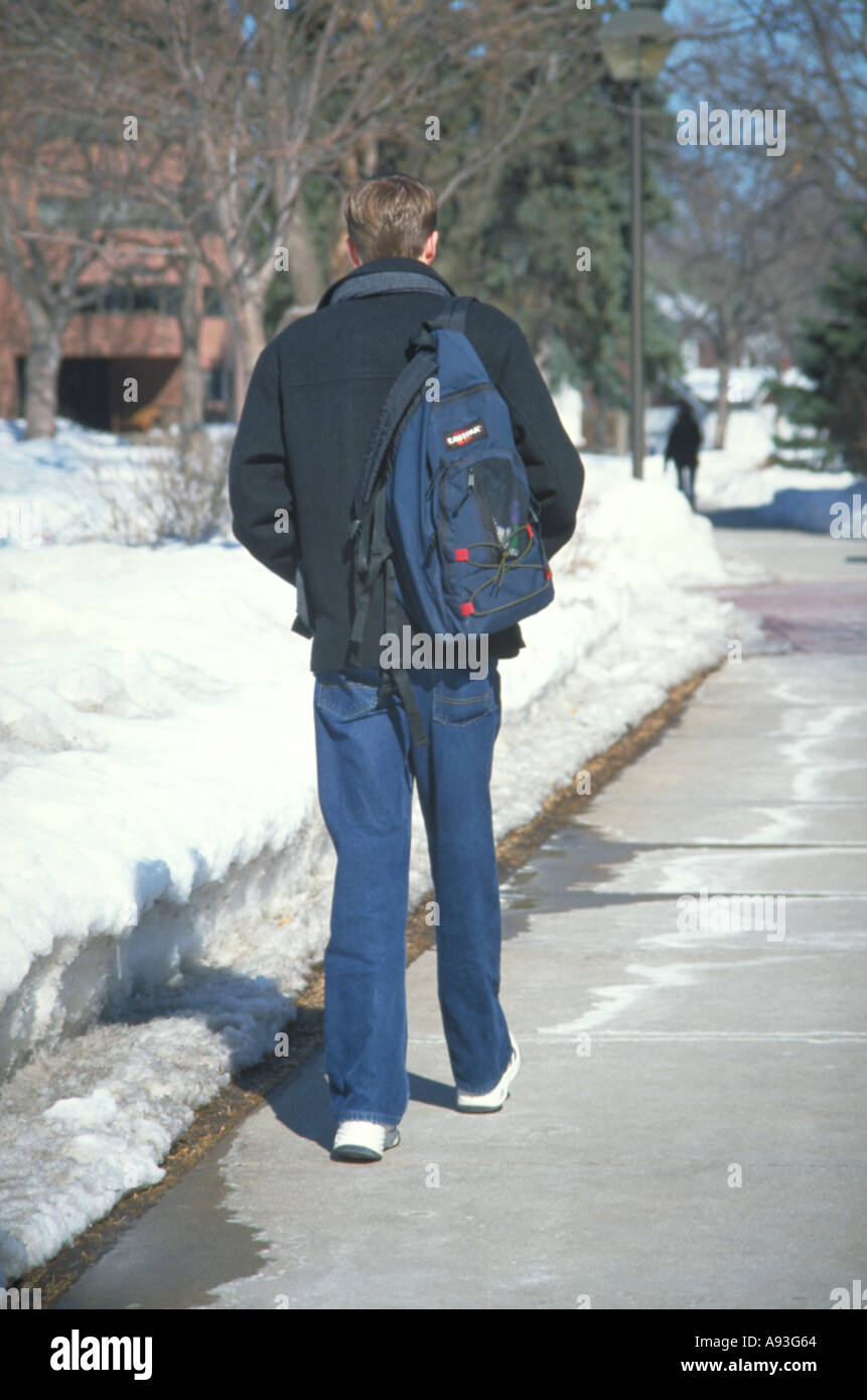 Young man walking between hi-res stock photography and images - Alamy