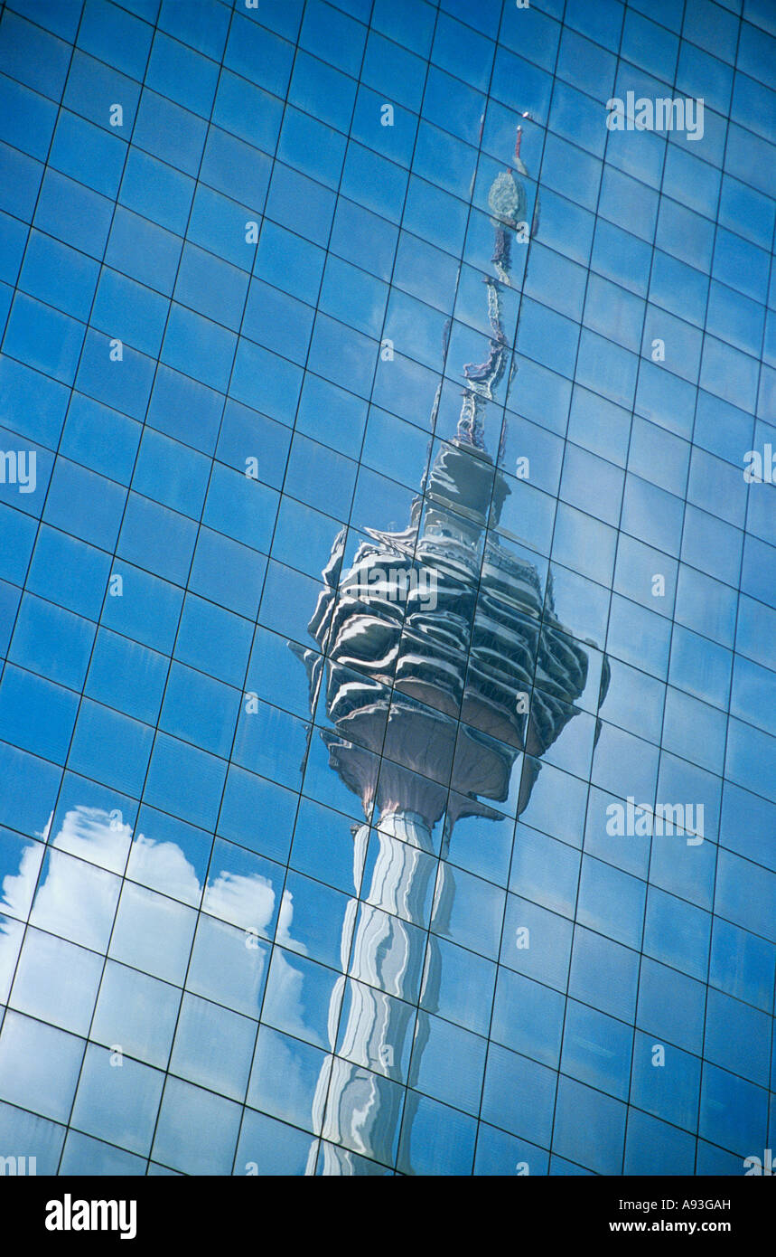 Distorted reflection of Kuala Lumpur Tower in building wall, full frame ...