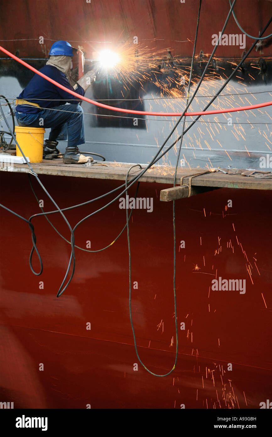 Welder in red protective hi-res stock photography and images - Alamy