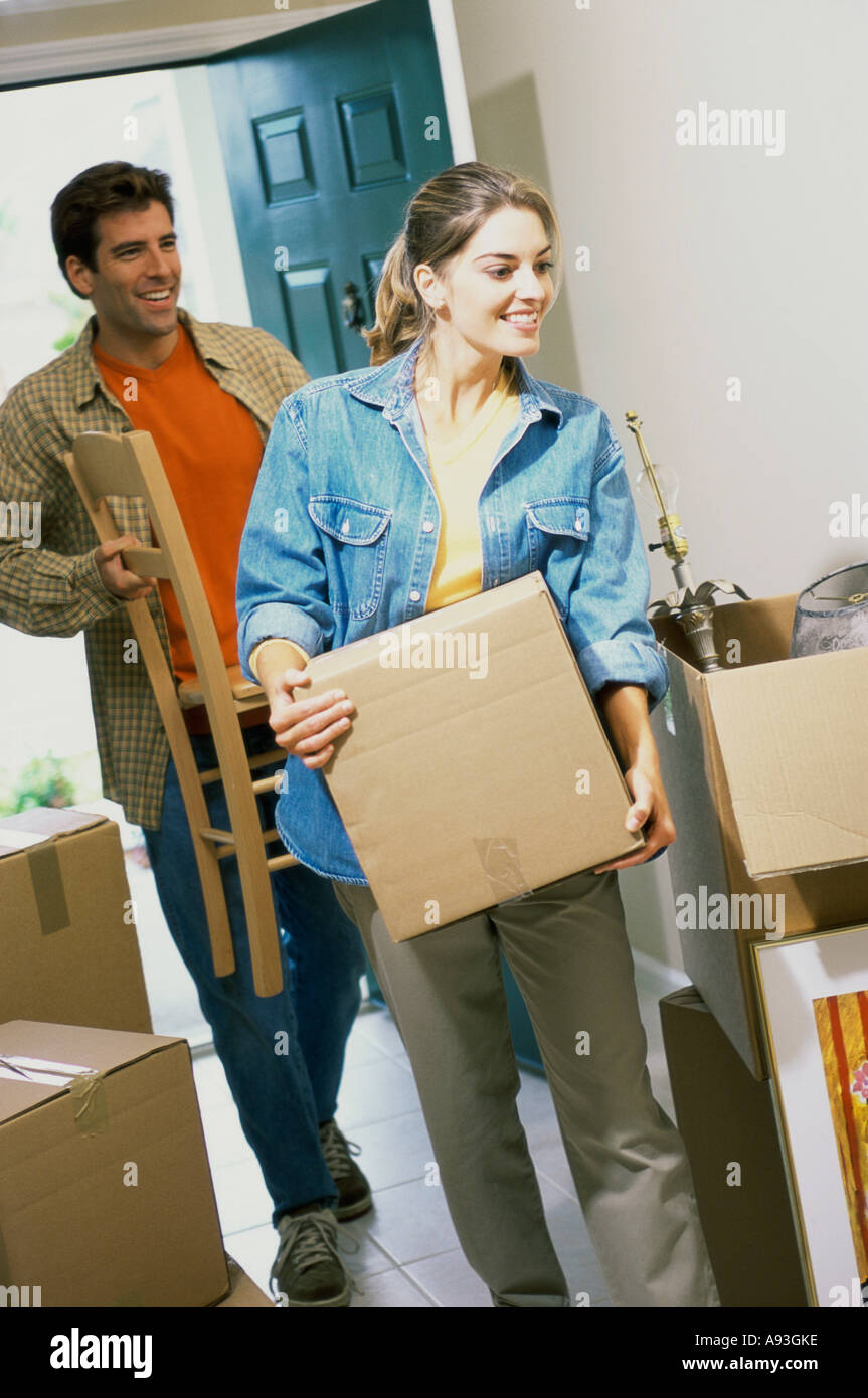 Young couple entering their new house Stock Photo - Alamy