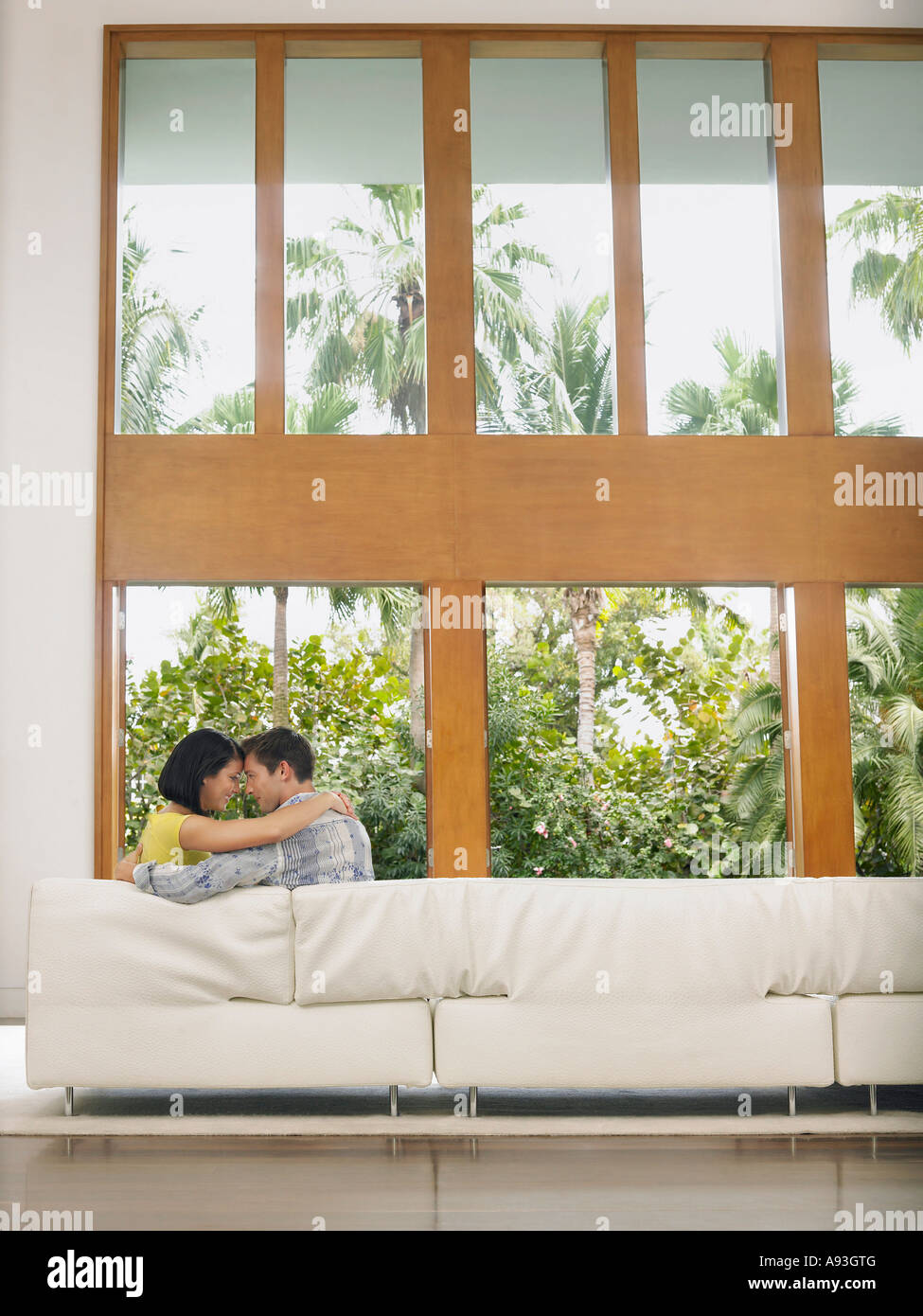 Couples Hugging On Sofa High Resolution Stock Photography and Images ...