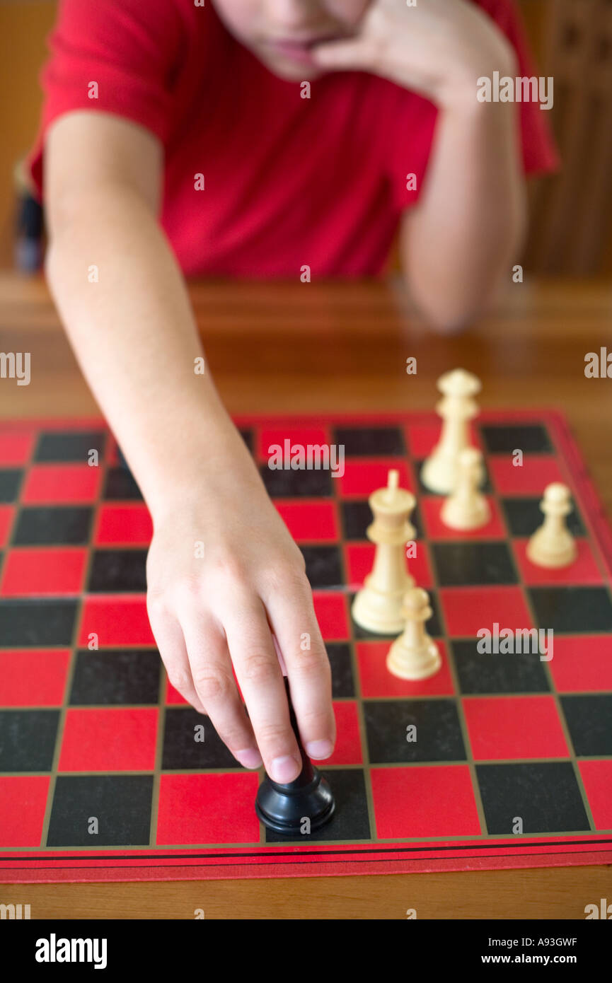 Boy playing chess Stock Photo - Alamy