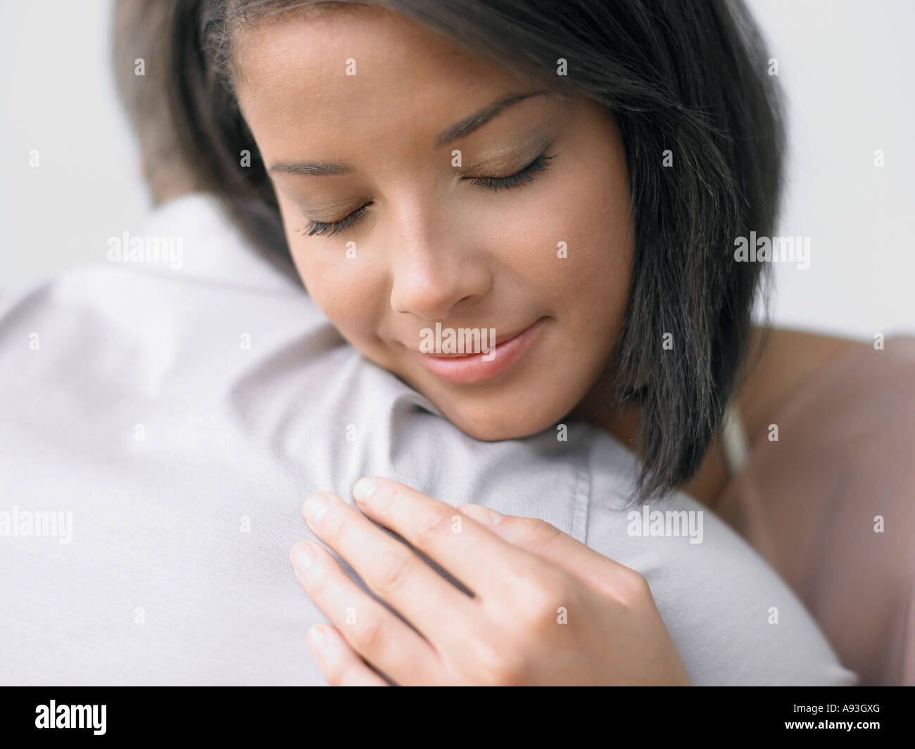 Young Couple Hugging Stock Photo - Alamy