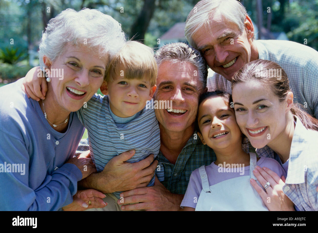 Portrait of a three generation family smiling Stock Photo - Alamy