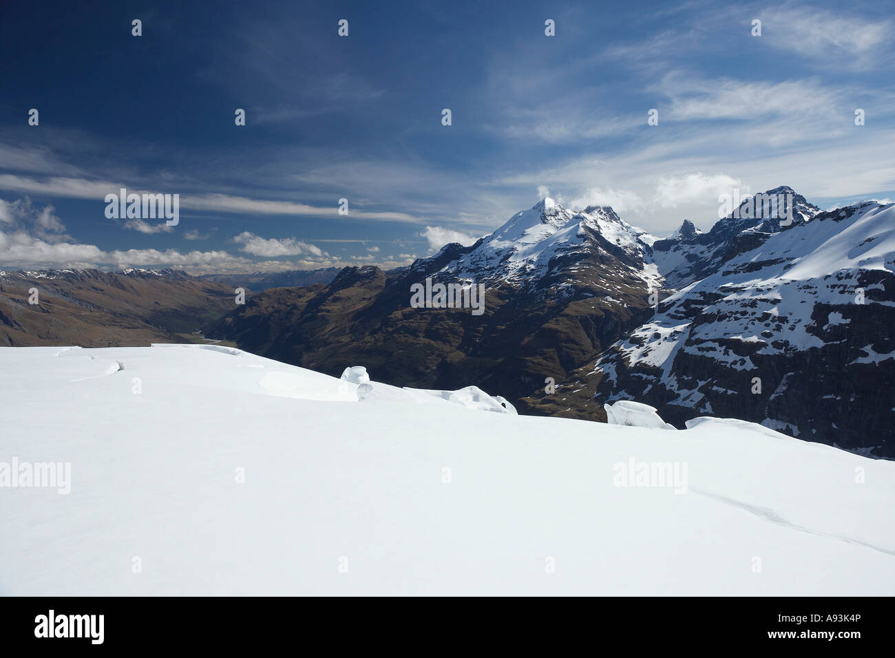 Snow field and mountains Stock Photo - Alamy