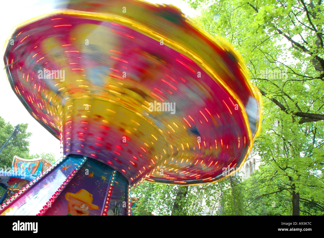colourful fairground carousel with motion blur Stock Photo - Alamy