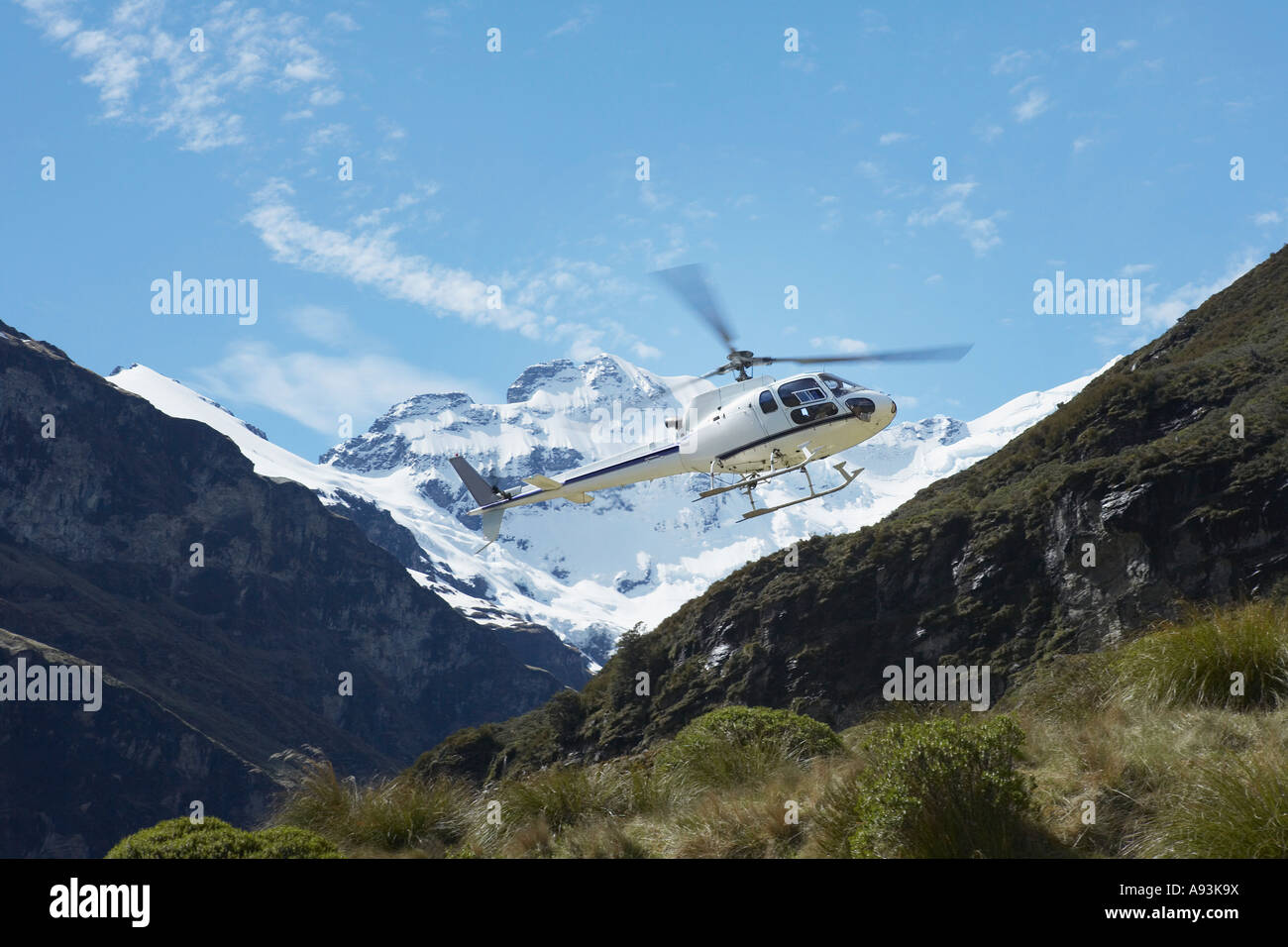 Helicopter over mountains Stock Photo - Alamy