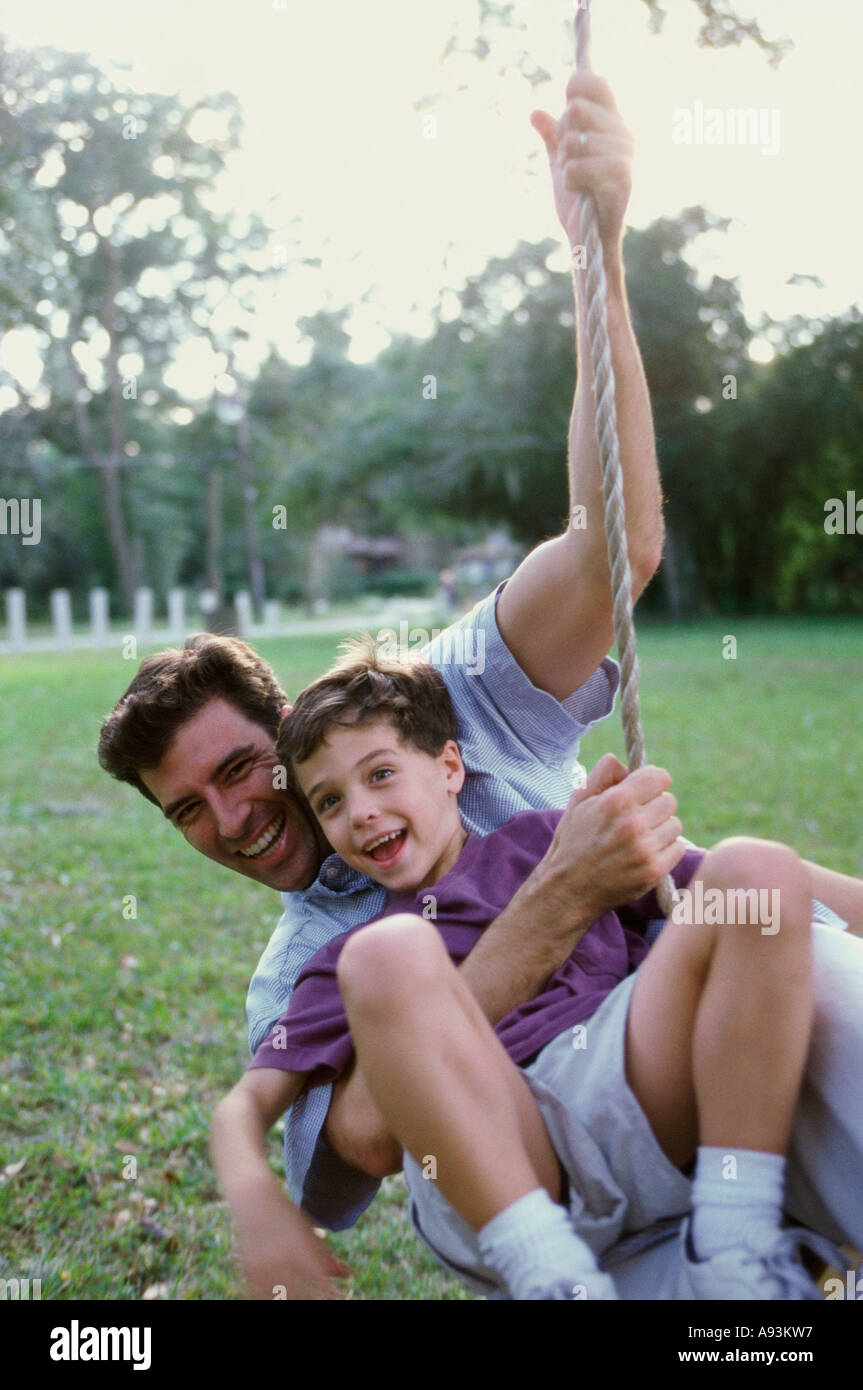 Two boys playing rope swing hi-res stock photography and images - Alamy