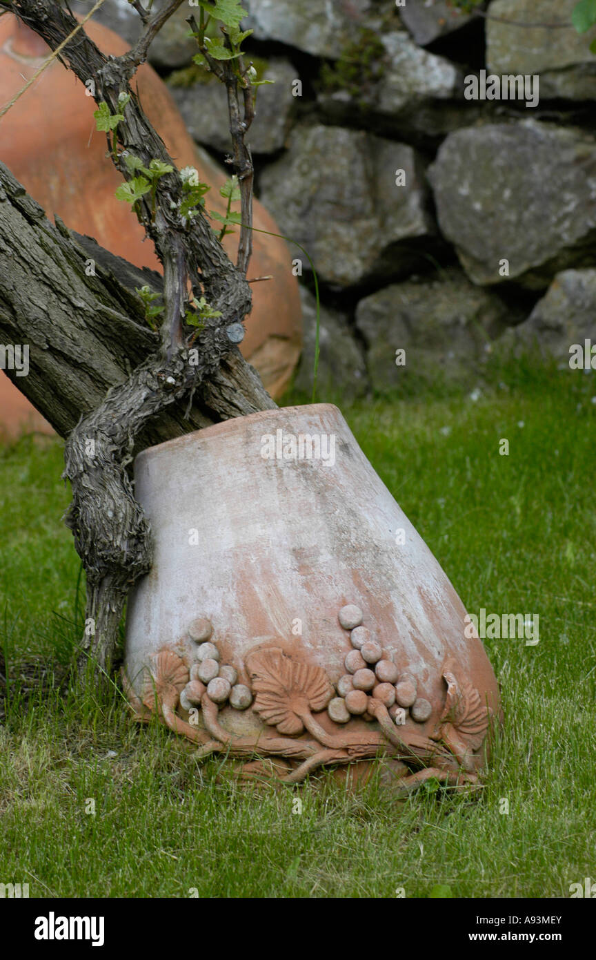 Giant pot of clay as garden decoration Stock Photo - Alamy