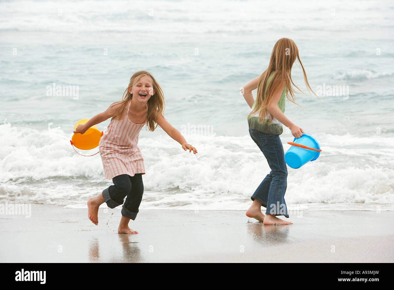 Girl holding two buckets hi-res stock photography and images - Alamy