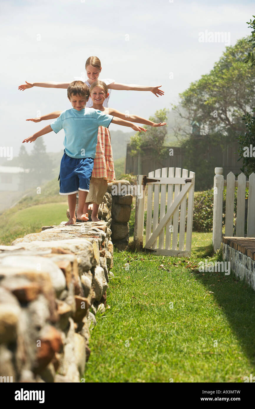 Three people walking gate hi-res stock photography and images - Alamy