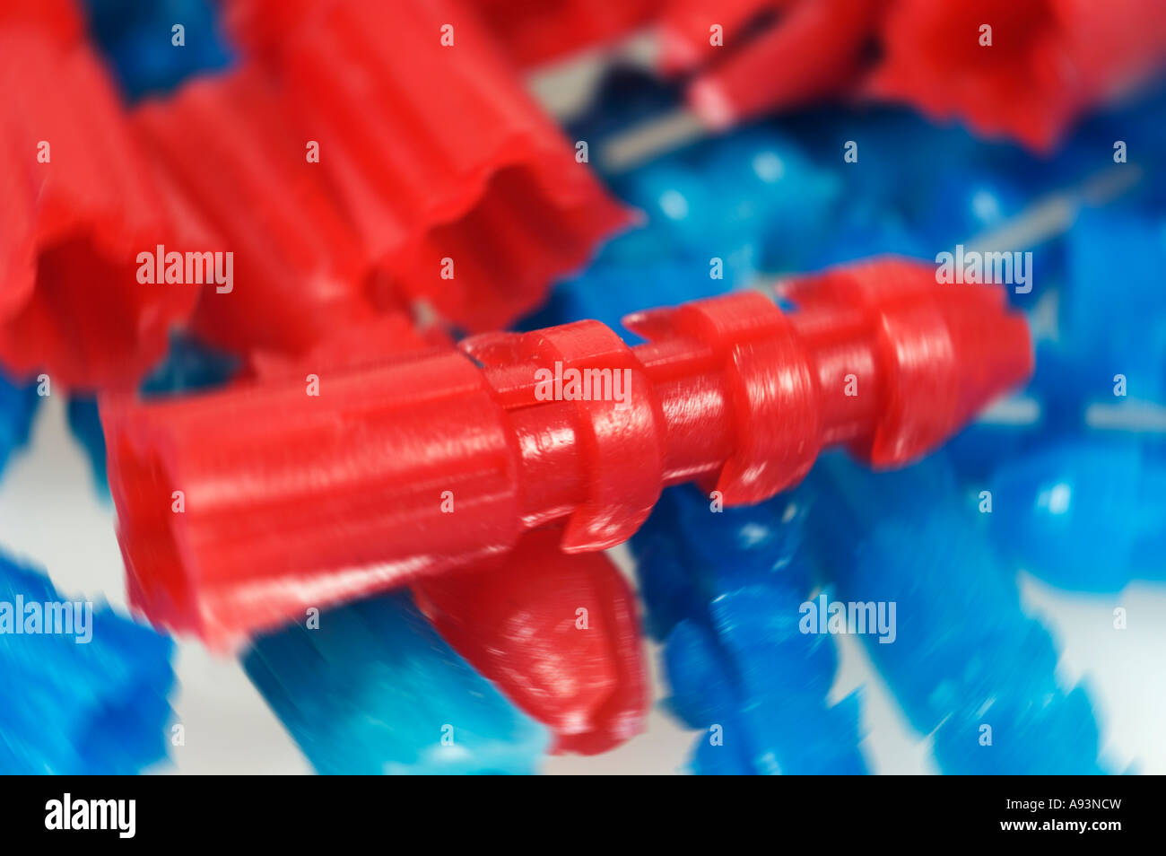 Blue and red pegs Stock Photo - Alamy
