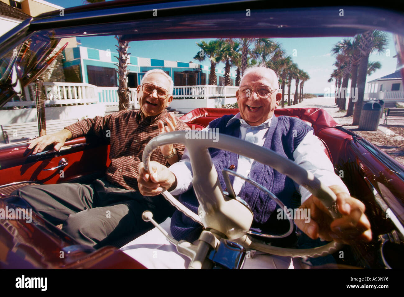 Portrait of two senior men sitting in a convertible car Stock Photo - Alamy