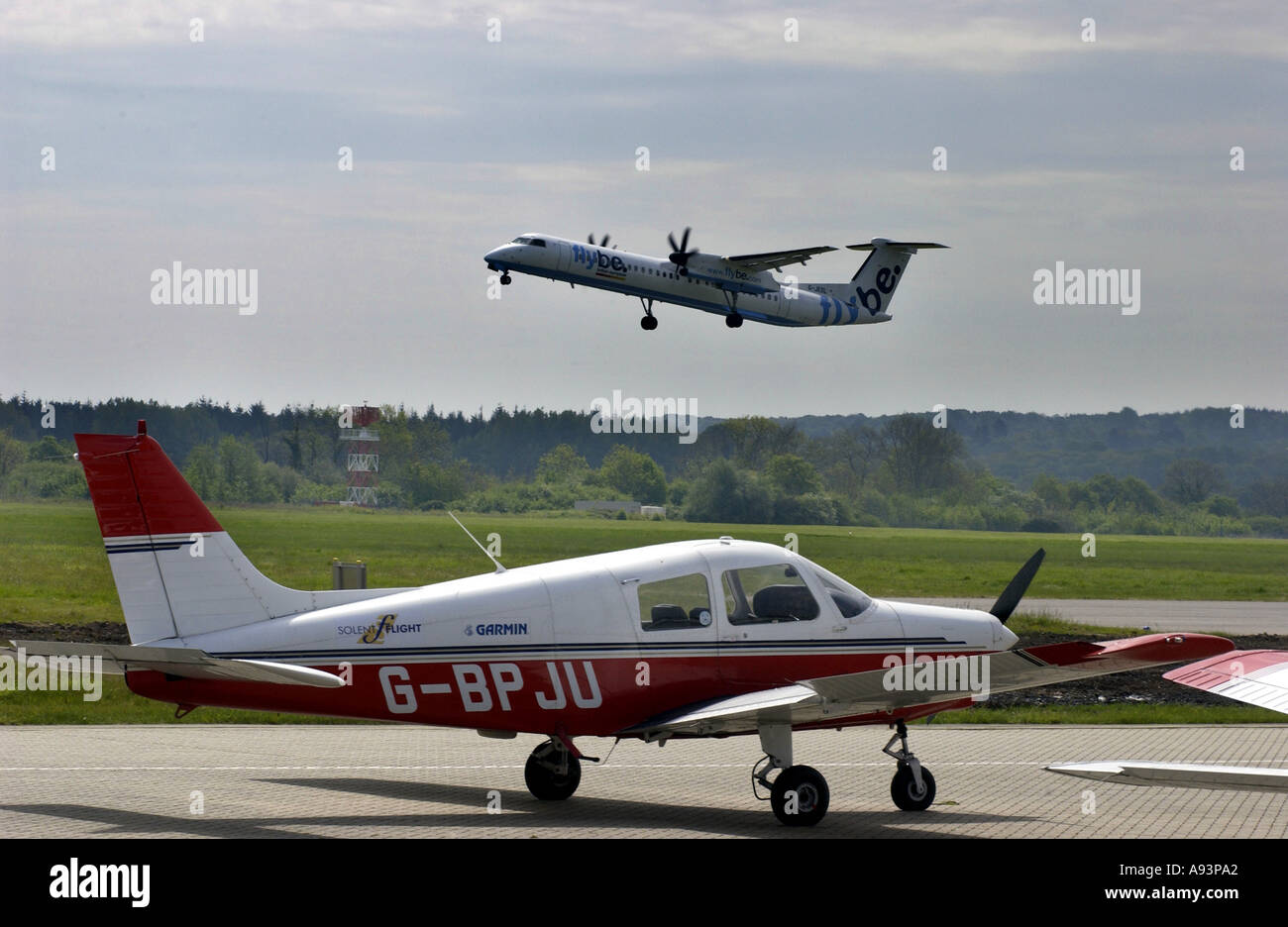 Flybe plane taking off from Southampton Airport and light aircraft ...