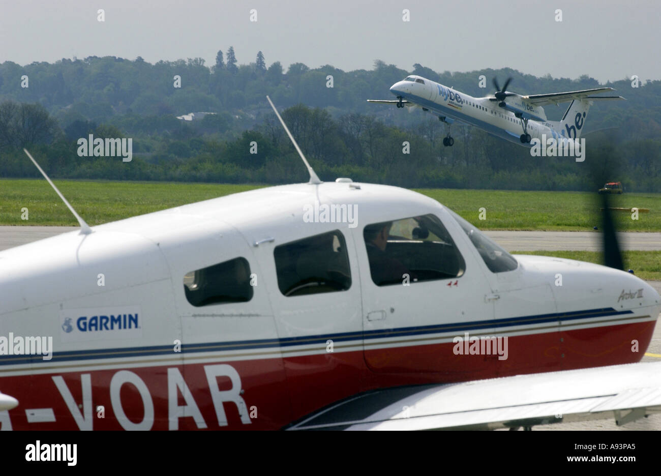 Flybe plane taking off from Southampton Airport with light aircraft ...
