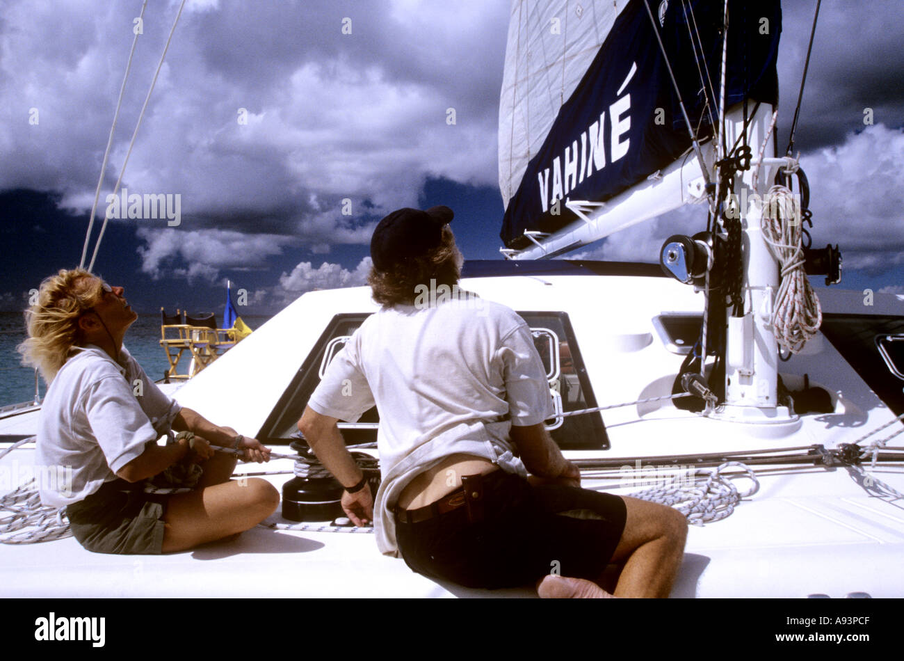 Crew of Vahiné catamaran yacht take to the ropes to tack the yacht back ...