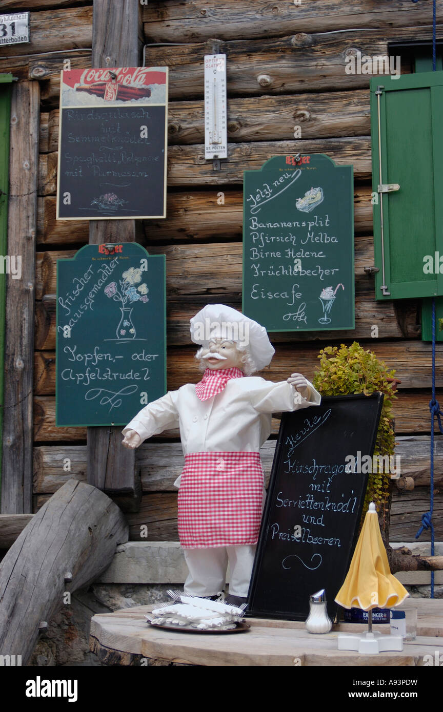 Cook figure at mountain hut Stock Photo - Alamy