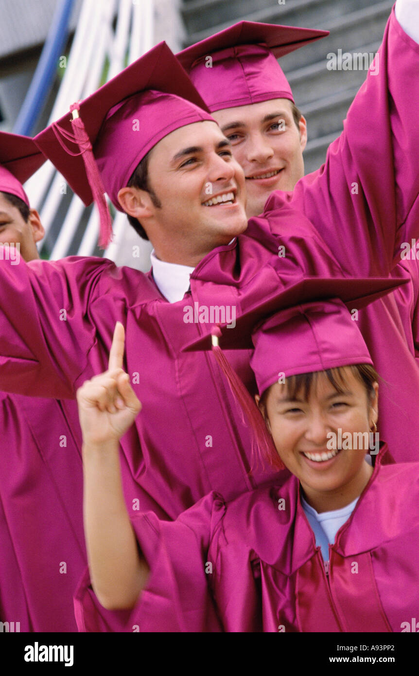 Three young graduates smiling Stock Photo - Alamy