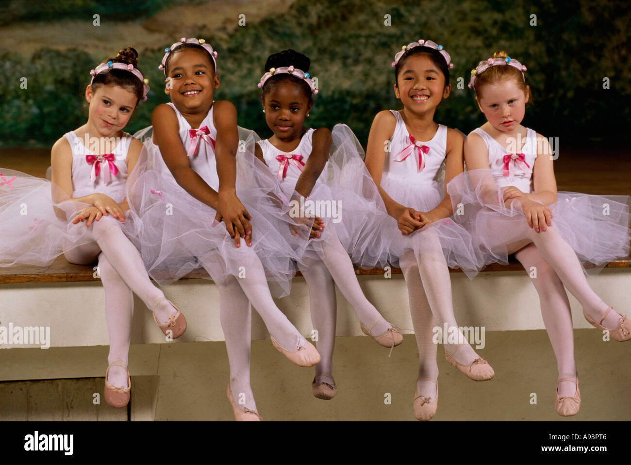 Group of ballet dancers sitting together Stock Photo - Alamy