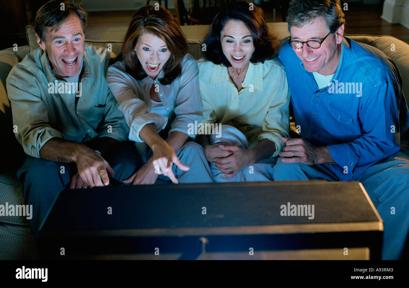 Group of mature adults watching television Stock Photo - Alamy