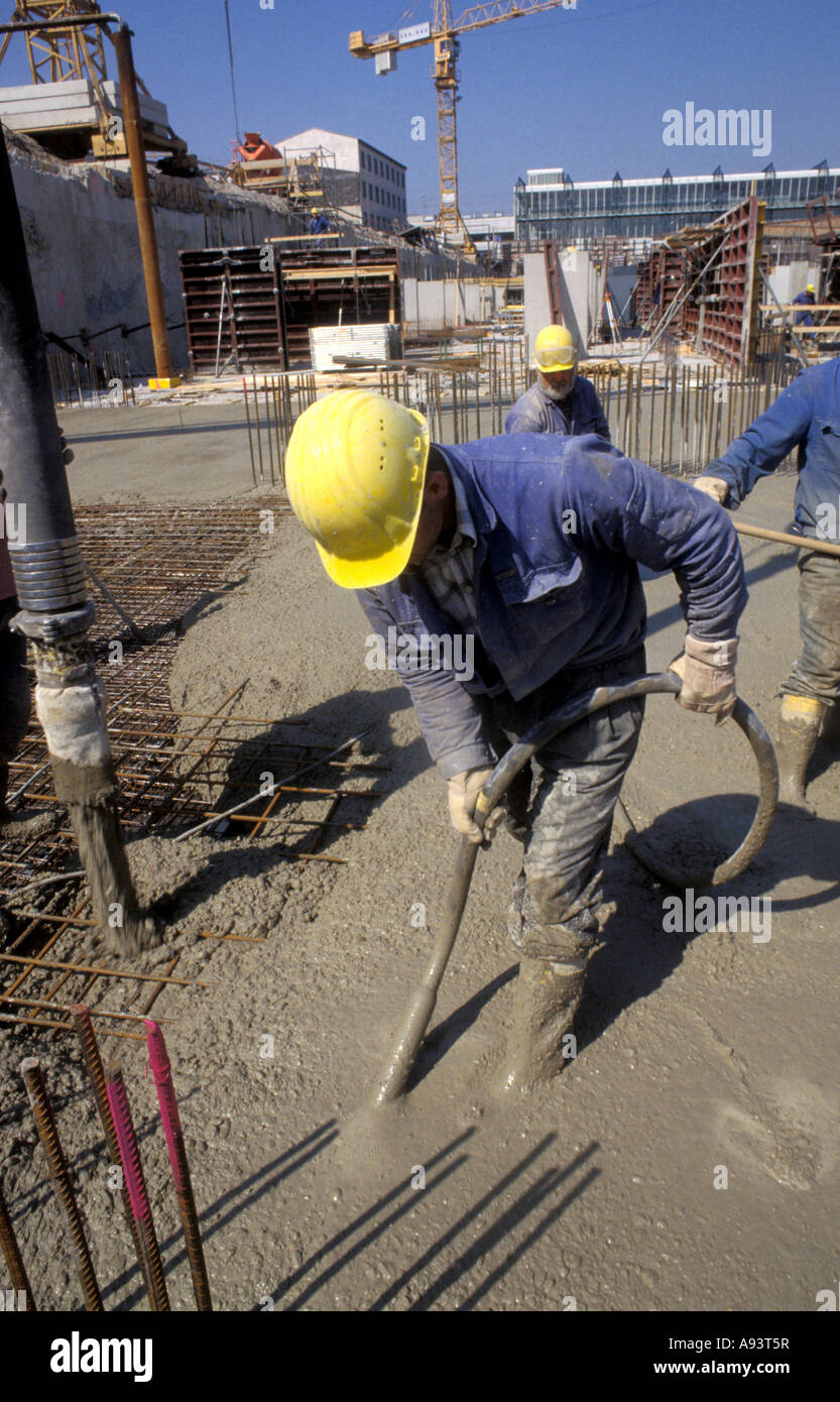 Building worker concreting on a construction site Stock Photo - Alamy