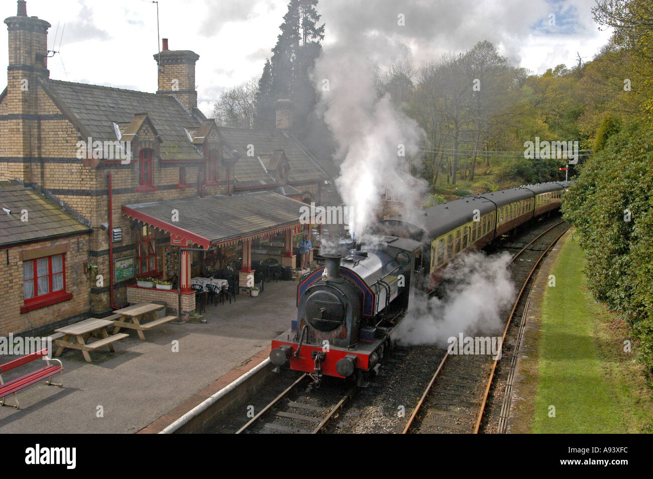 steam locomotive departing from station Stock Photo - Alamy