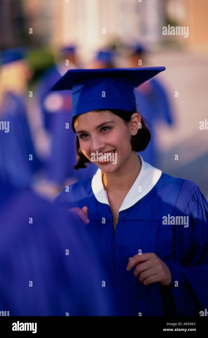 Female teenage graduate smiling Stock Photo - Alamy