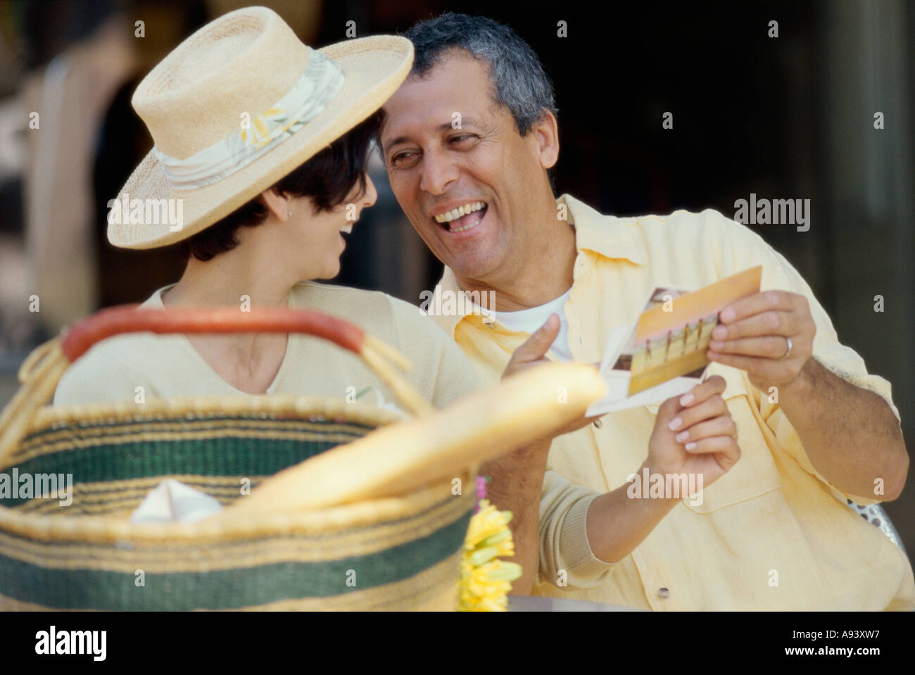 Mature couple choosing postcards Stock Photo - Alamy