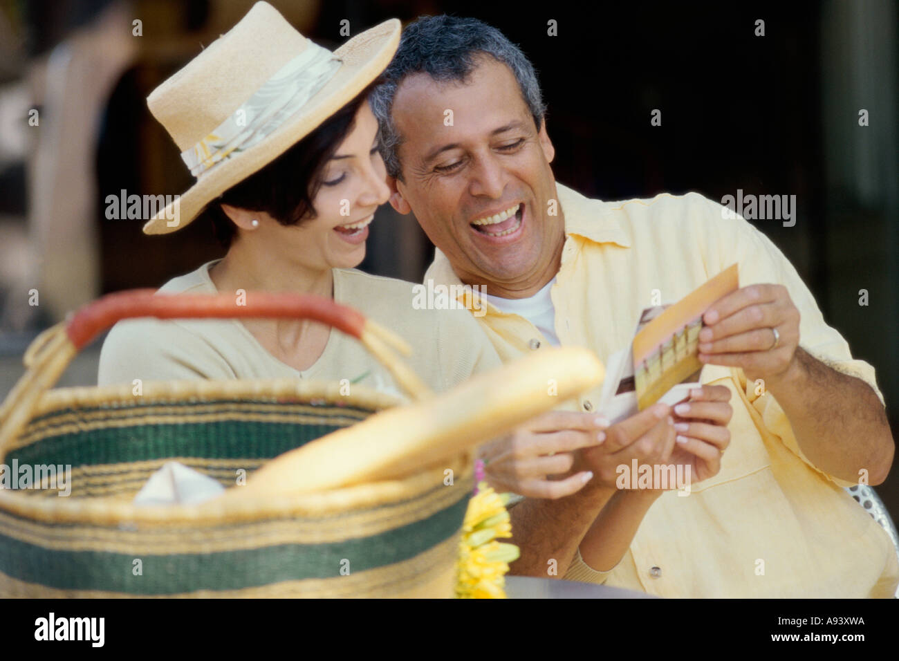 Mature couple choosing postcards Stock Photo - Alamy