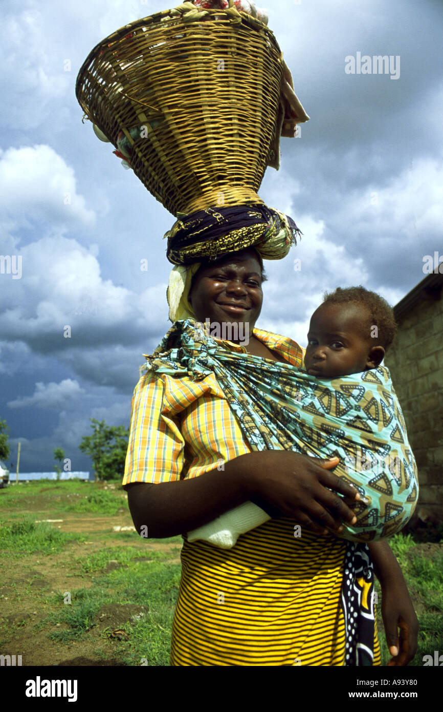 a woman in Misisi township Lusaka Zambia carries her laundry home www ...