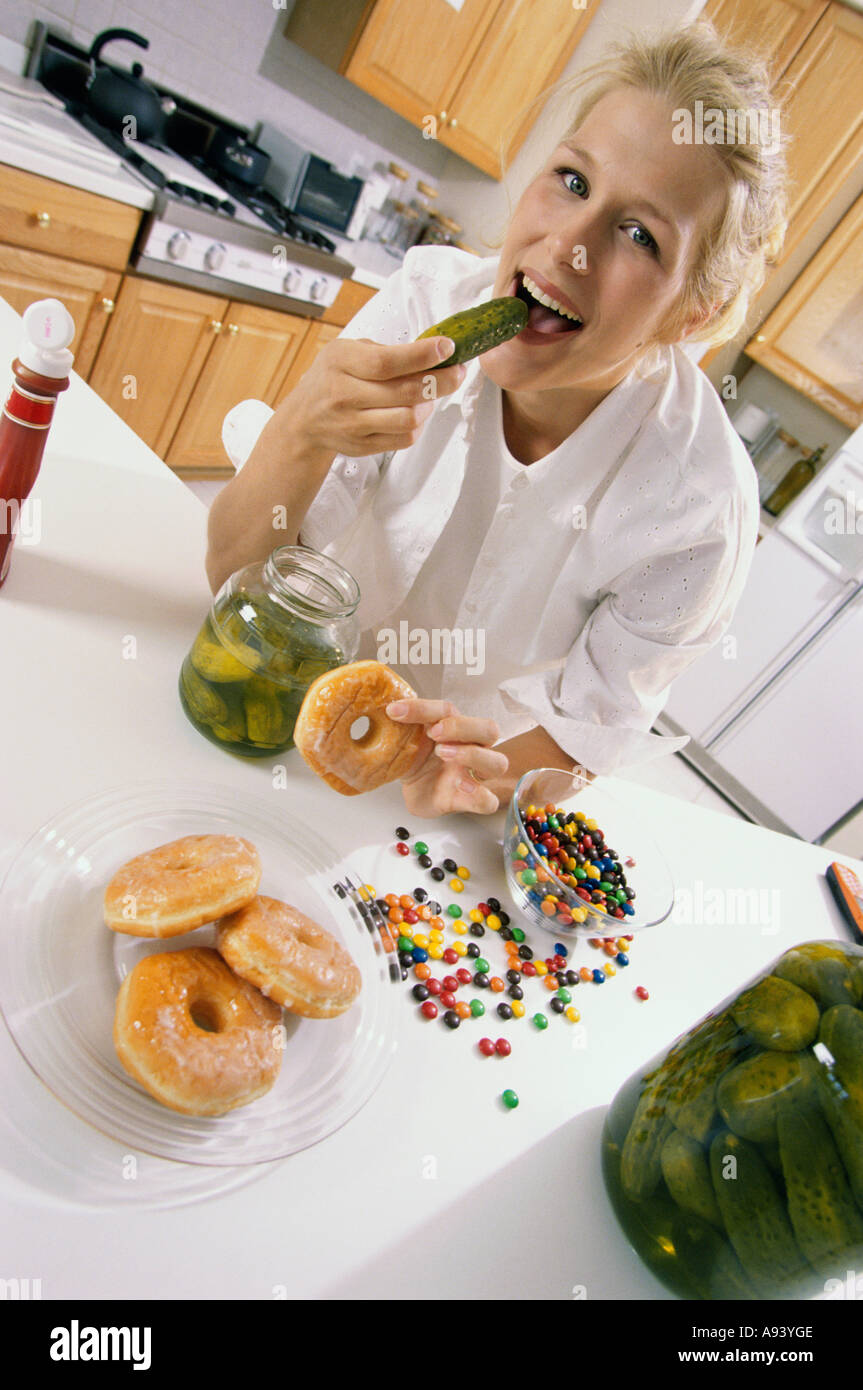 Woman eating a pickle hi-res stock photography and images - Alamy