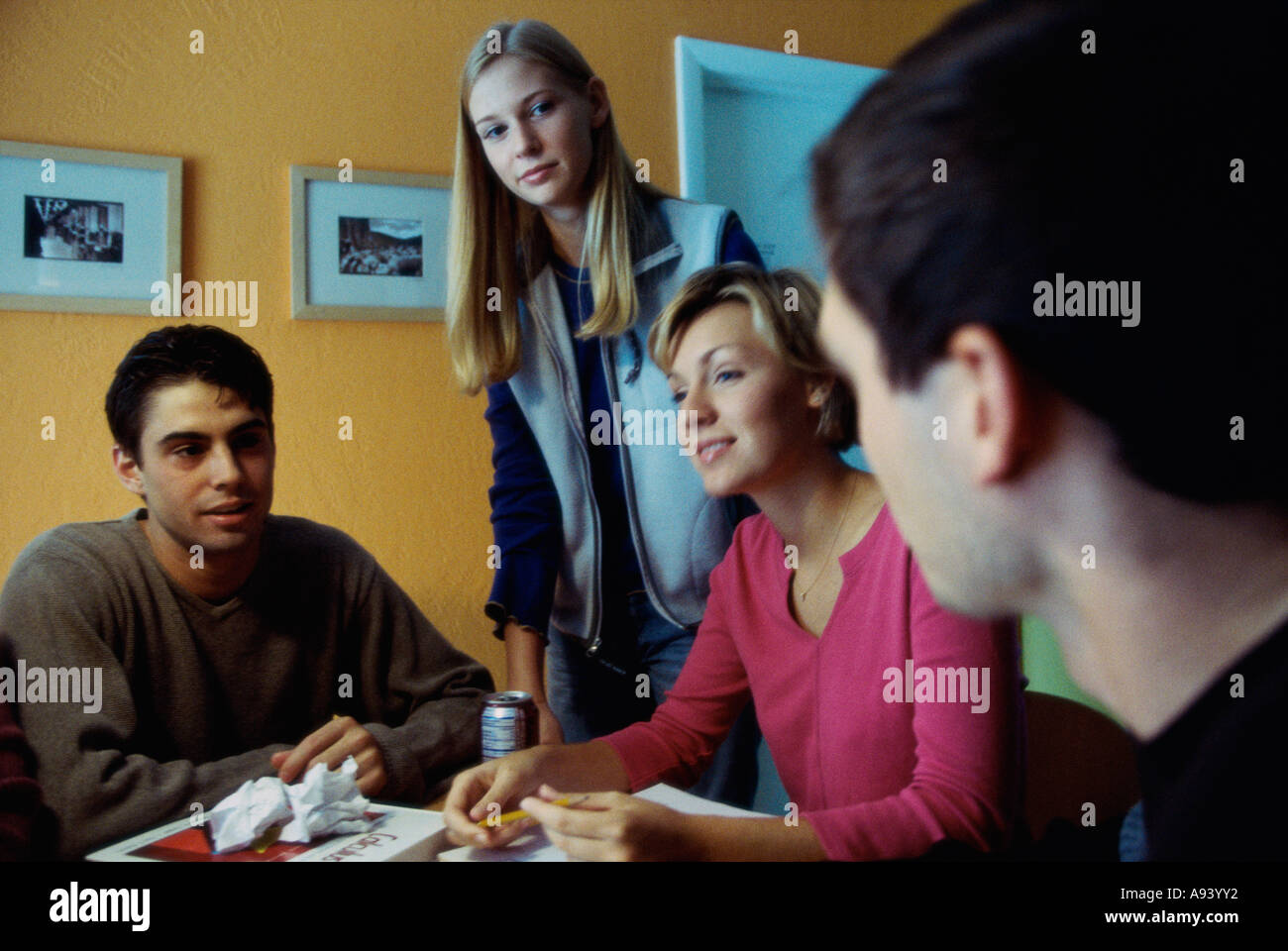Two teenage boys and two teenage girls in a discussion Stock Photo - Alamy