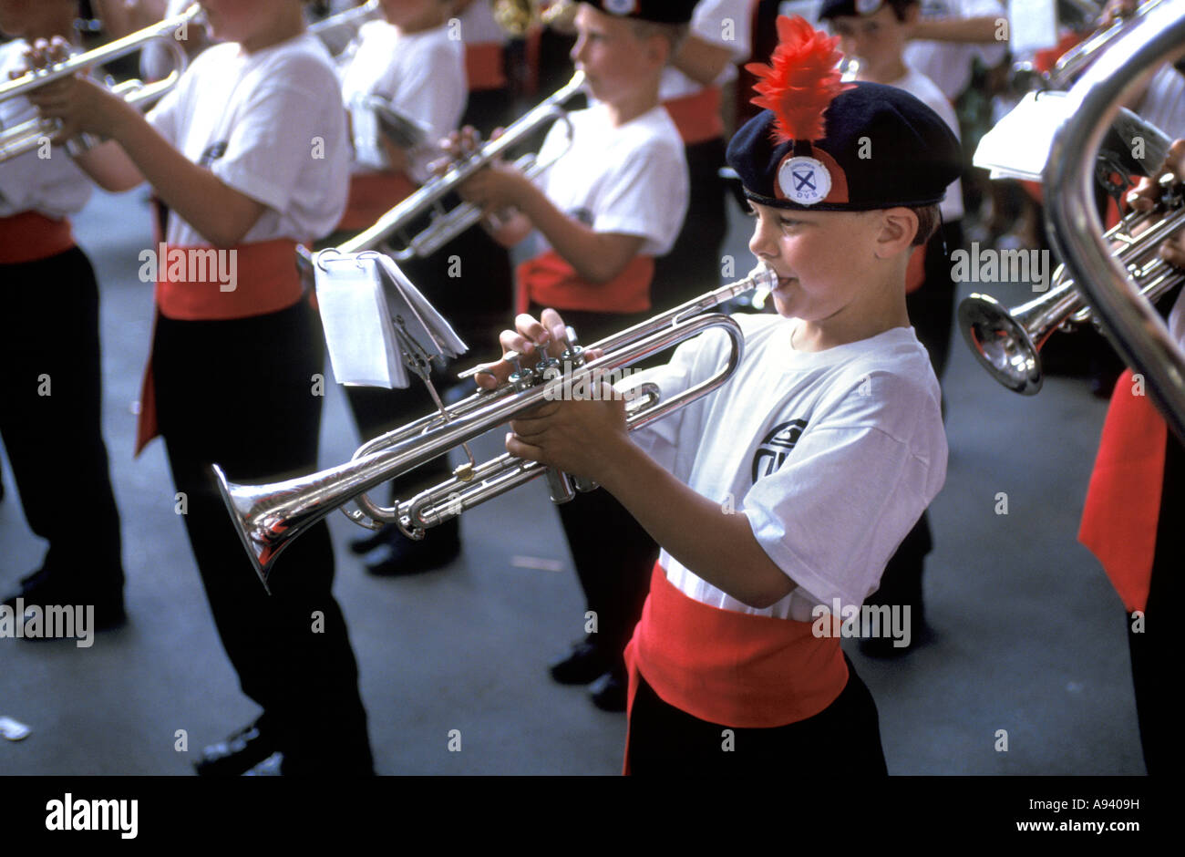 Little boy blowing a trumpet Stock Photo - Alamy