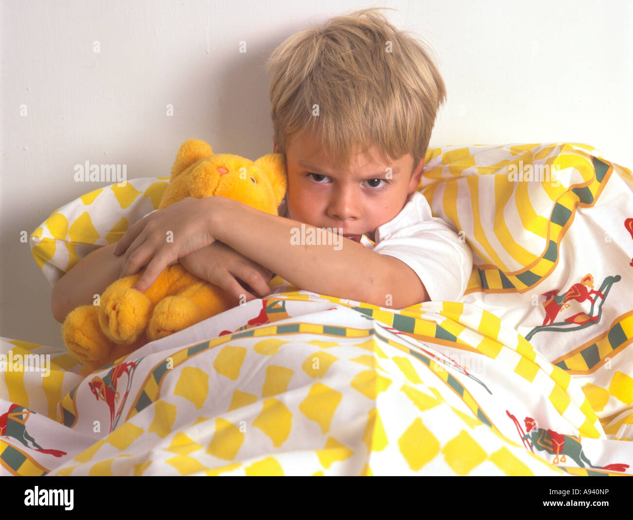 Little boy angry in his bed Stock Photo - Alamy