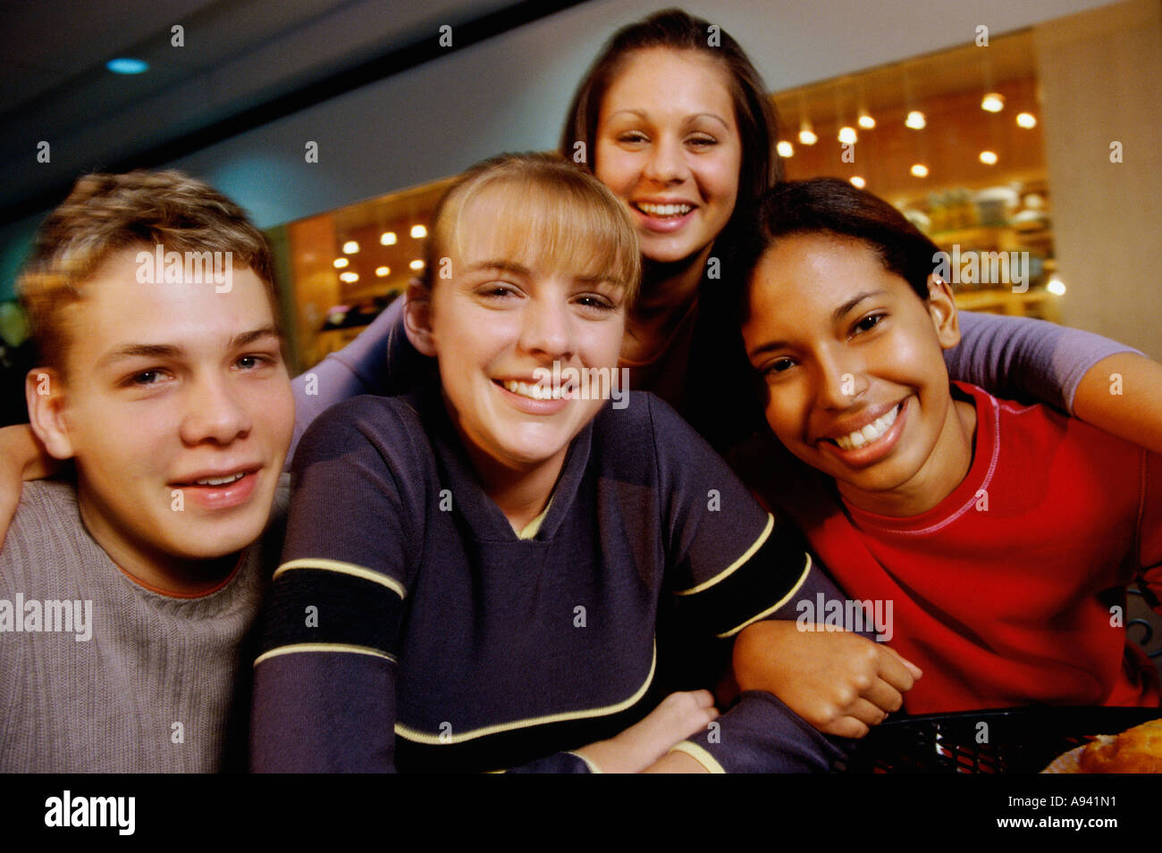 Portrait of a group of teenagers smiling Stock Photo - Alamy