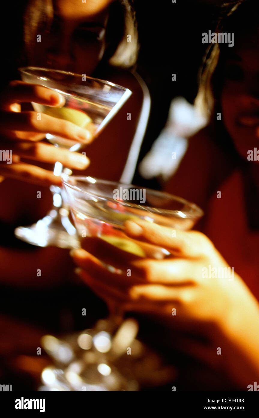 Two young women toasting in a bar Stock Photo - Alamy