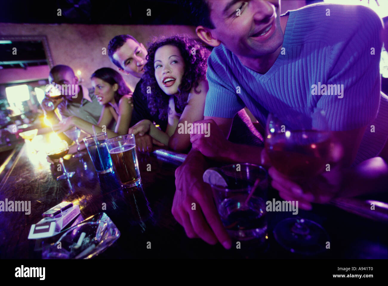 Group of people at a bar Stock Photo - Alamy