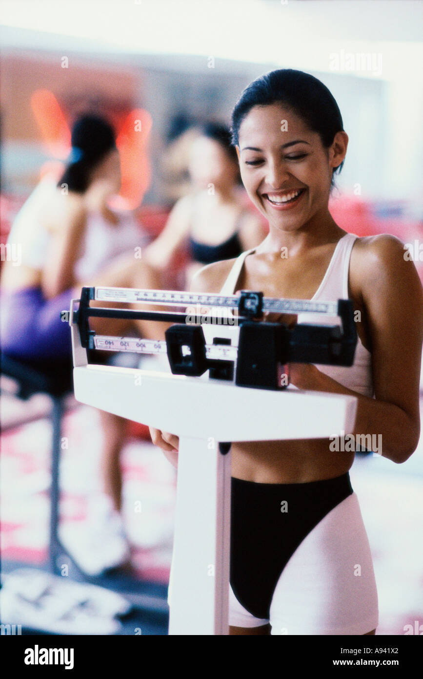 Woman on scale in hi-res stock photography and images - Alamy