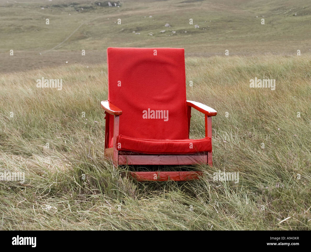 red chair in field Stock Photo - Alamy