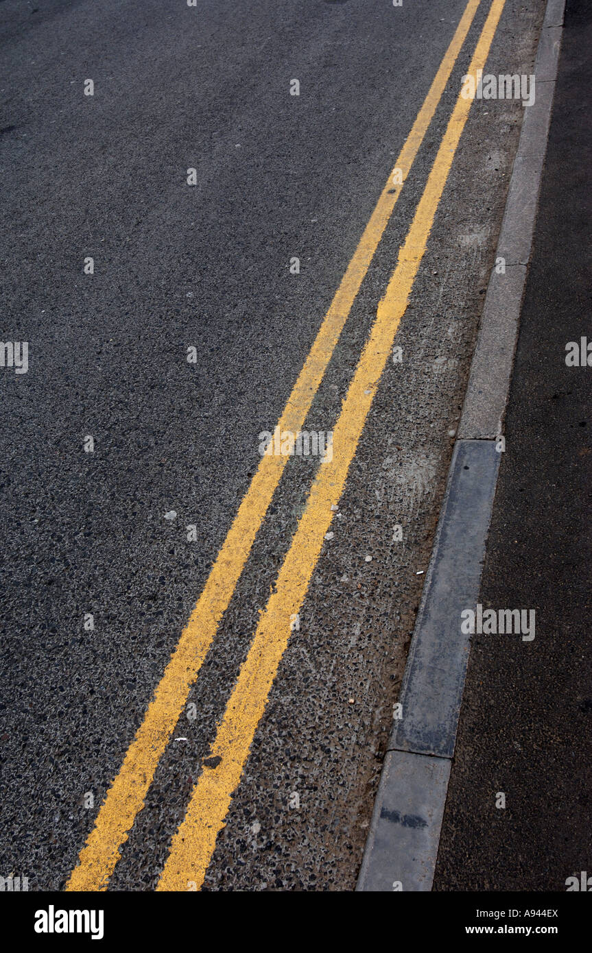 DOUBLE YELLOW LINES IN ROAD, UK Stock Photo - Alamy