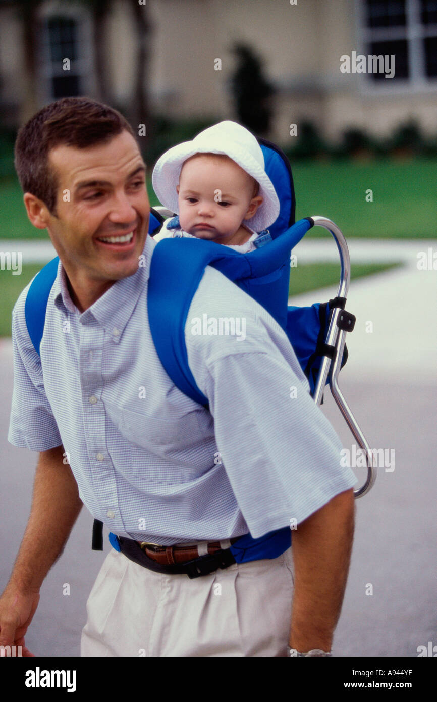 Father carrying his baby girl on his back Stock Photo - Alamy