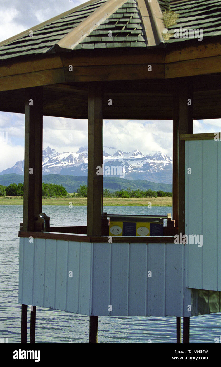 birdwatching lakeside hut at parc torres del paine with mountains in ...