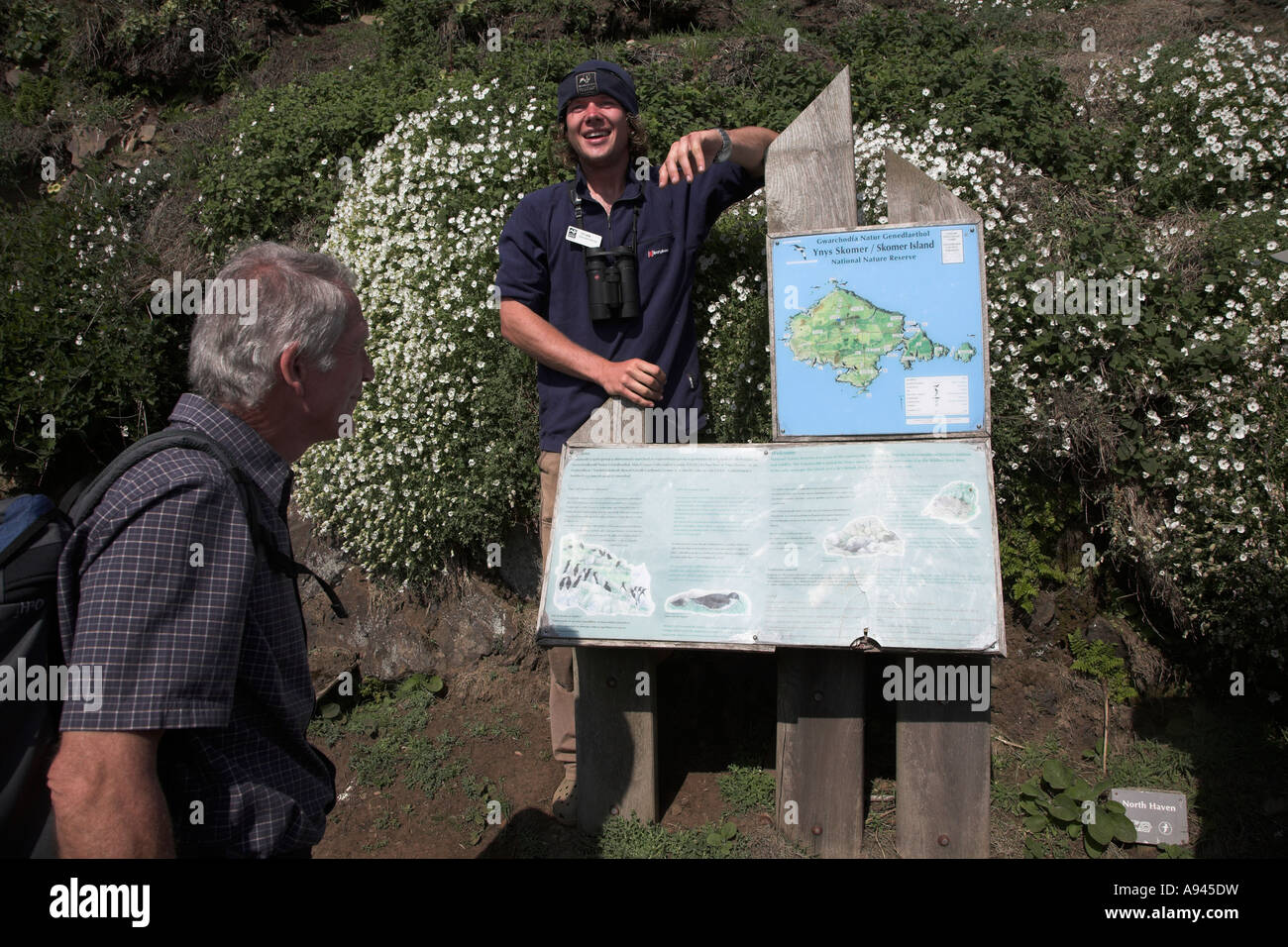 Assistant warden with map Skomer Island, Pembrokeshire coast national ...