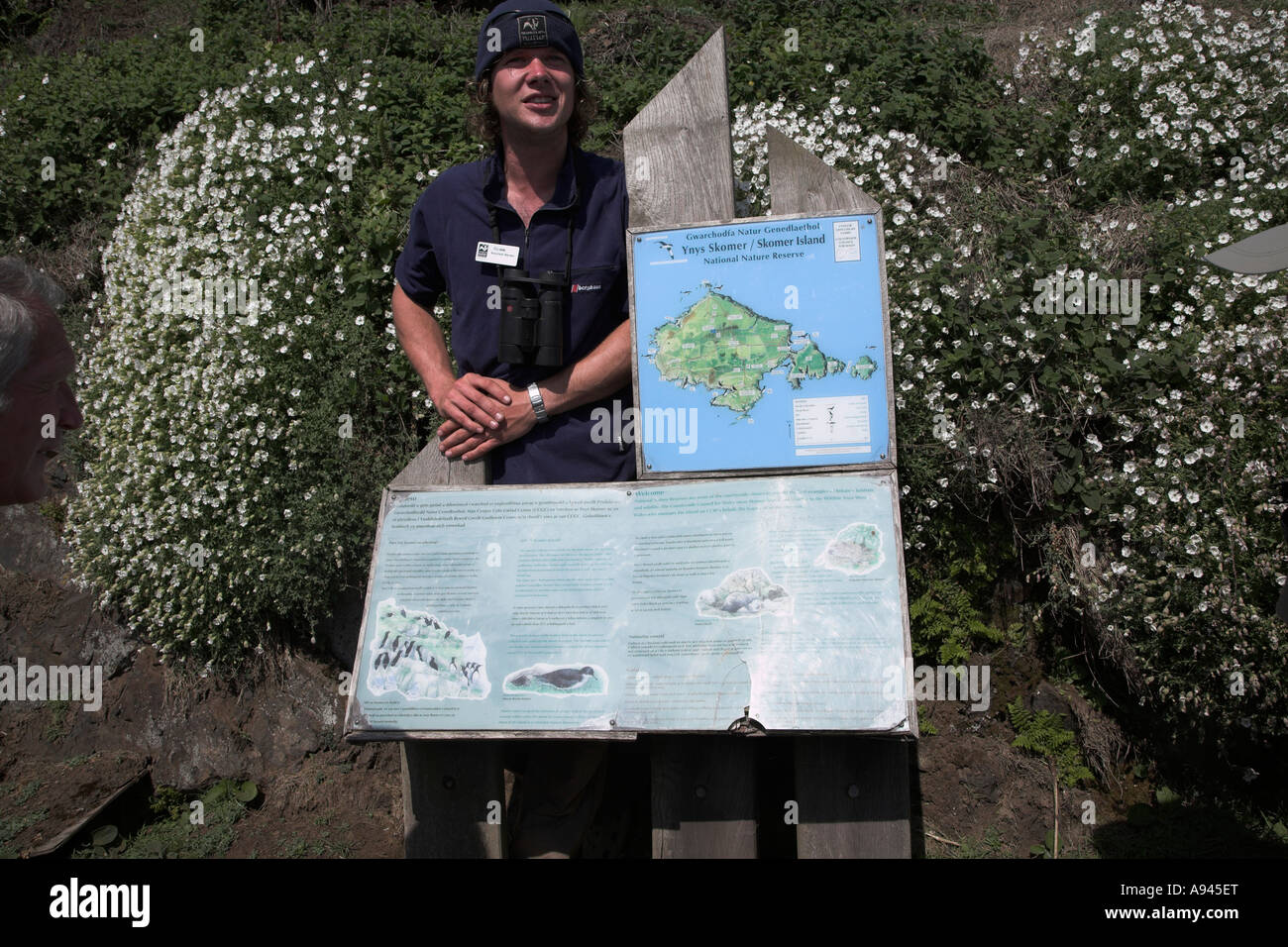 Assistant warden with map Skomer Island, Pembrokeshire coast national ...