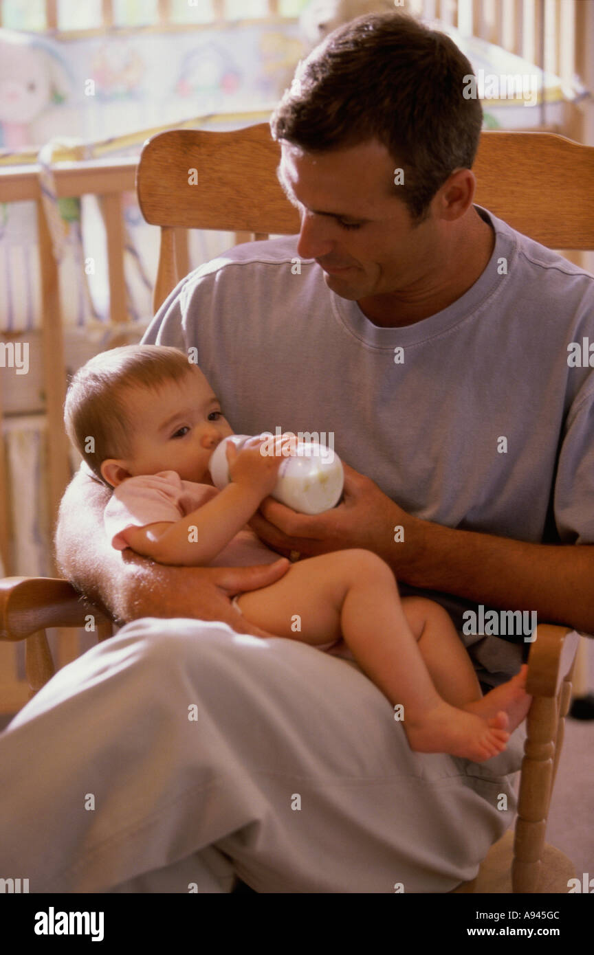 Father feeding his daughter Stock Photo - Alamy