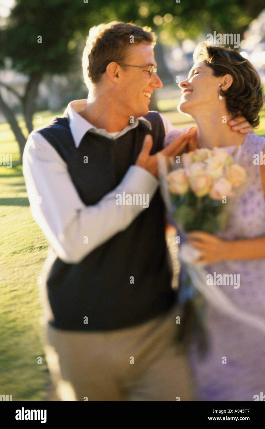 Mid adult couple smiling at each other Stock Photo - Alamy