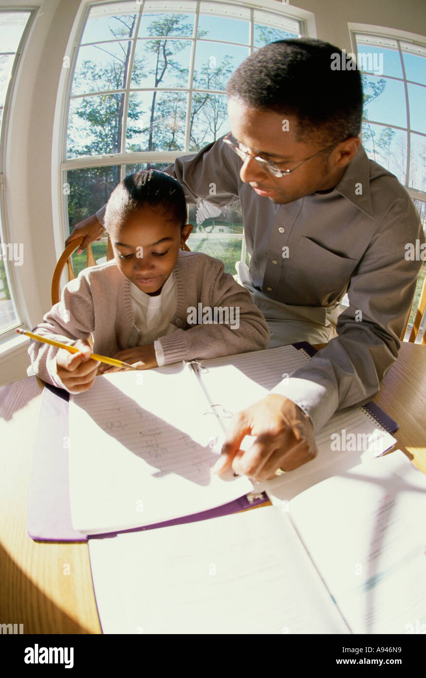 Father help girl write hi-res stock photography and images - Alamy