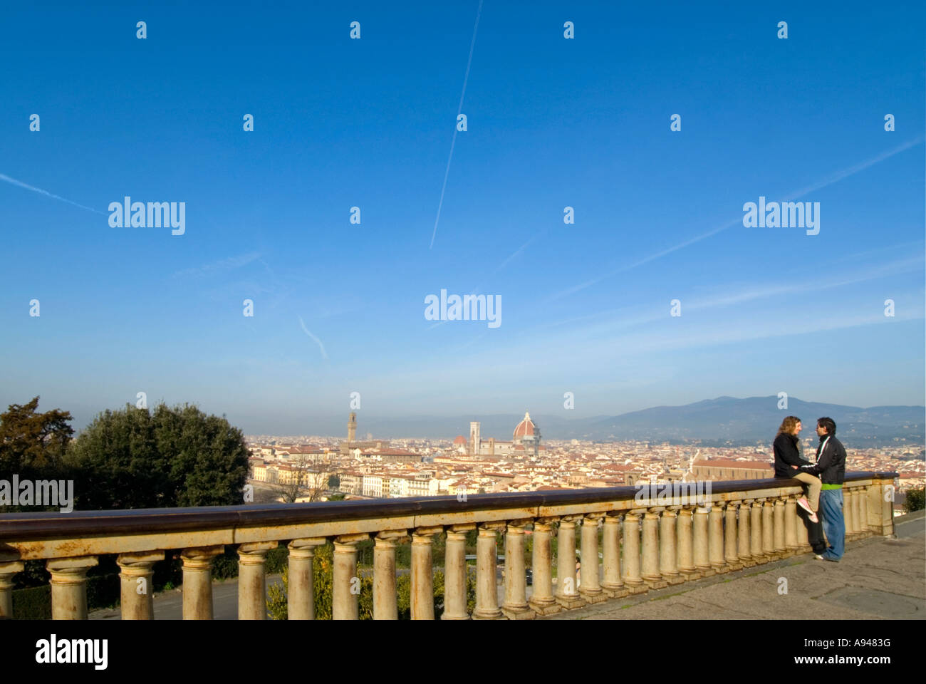 Horizontal aerial wide angle of a romantic couple enjoying the views ...
